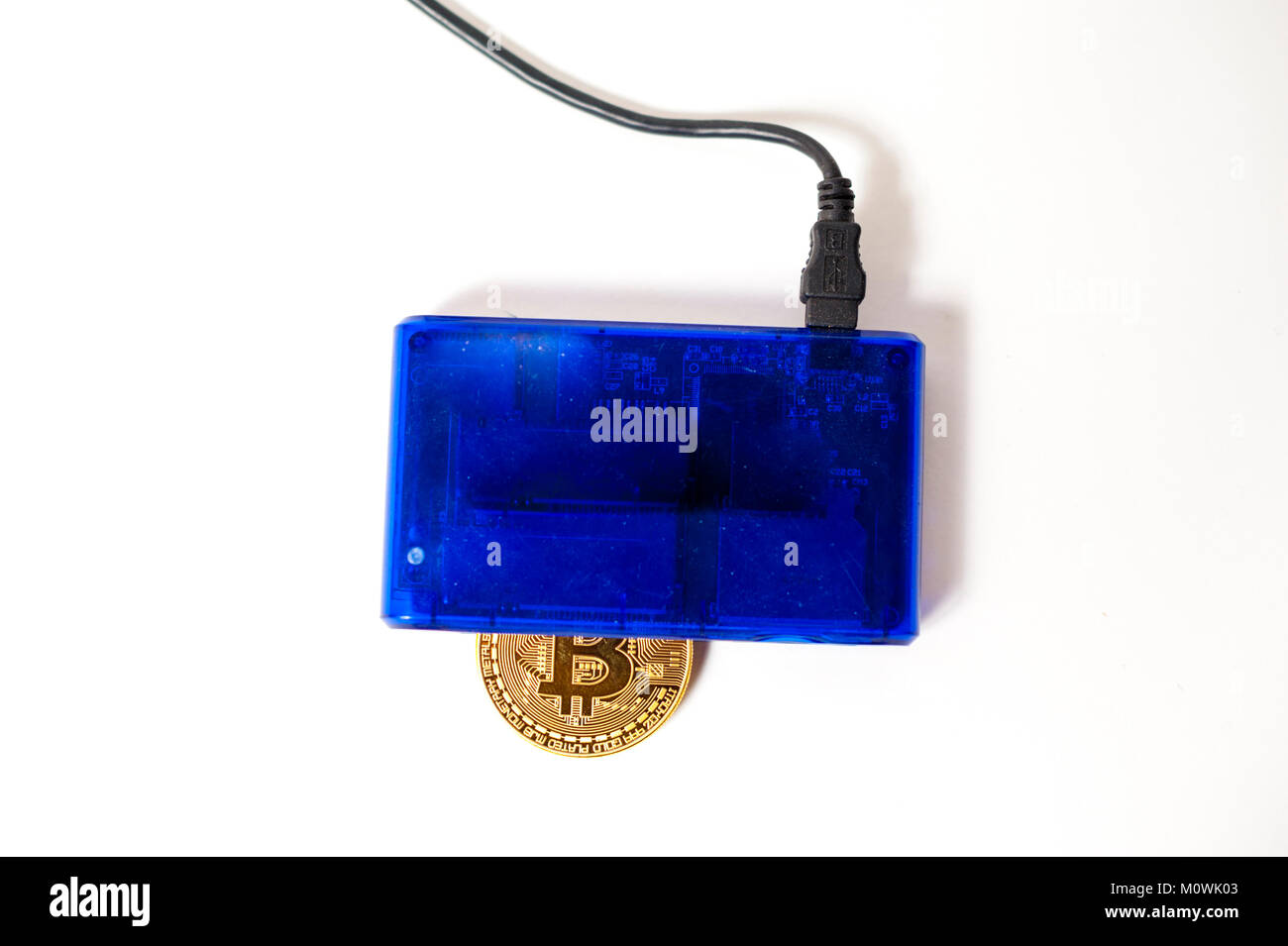 bitcoin electronic coin inside a digital card reader, white background ...