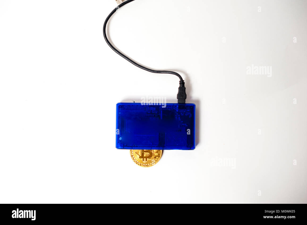 bitcoin electronic coin inside a digital card reader, white background ...