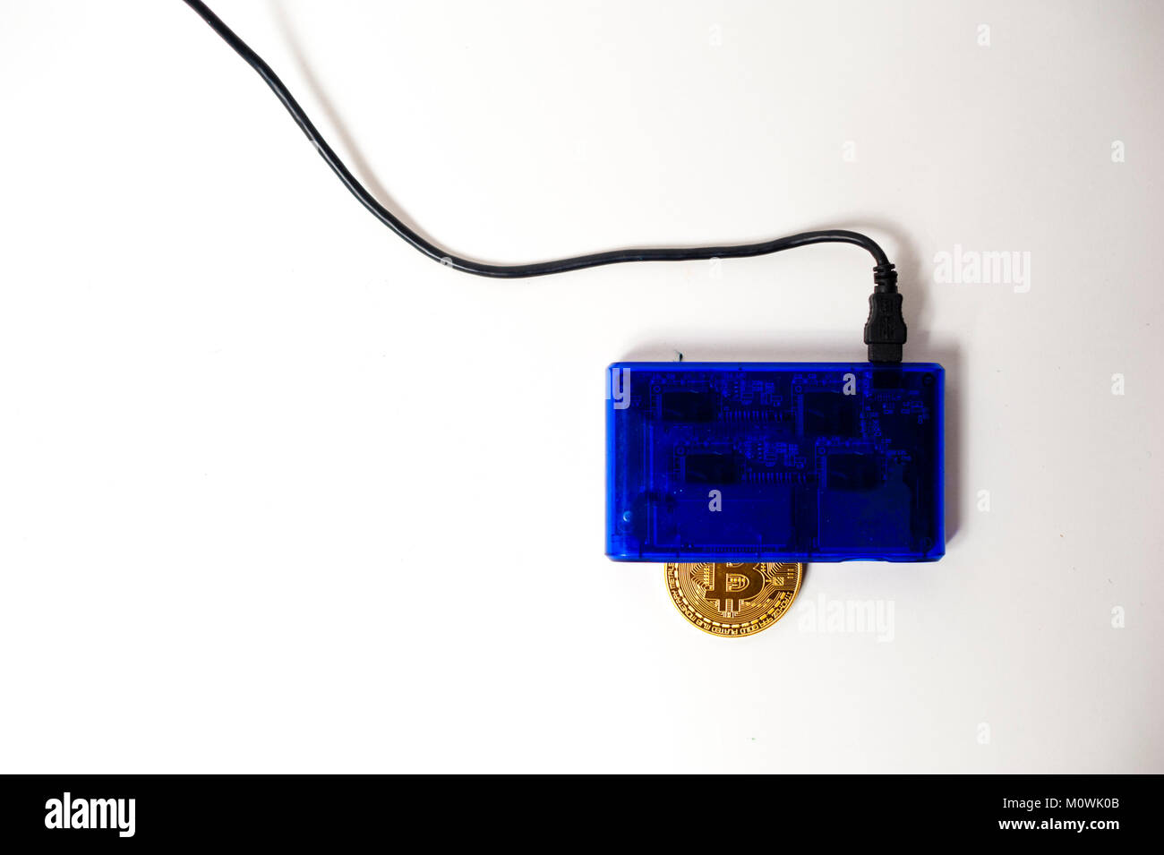 bitcoin electronic coin inside a digital card reader, white background ...