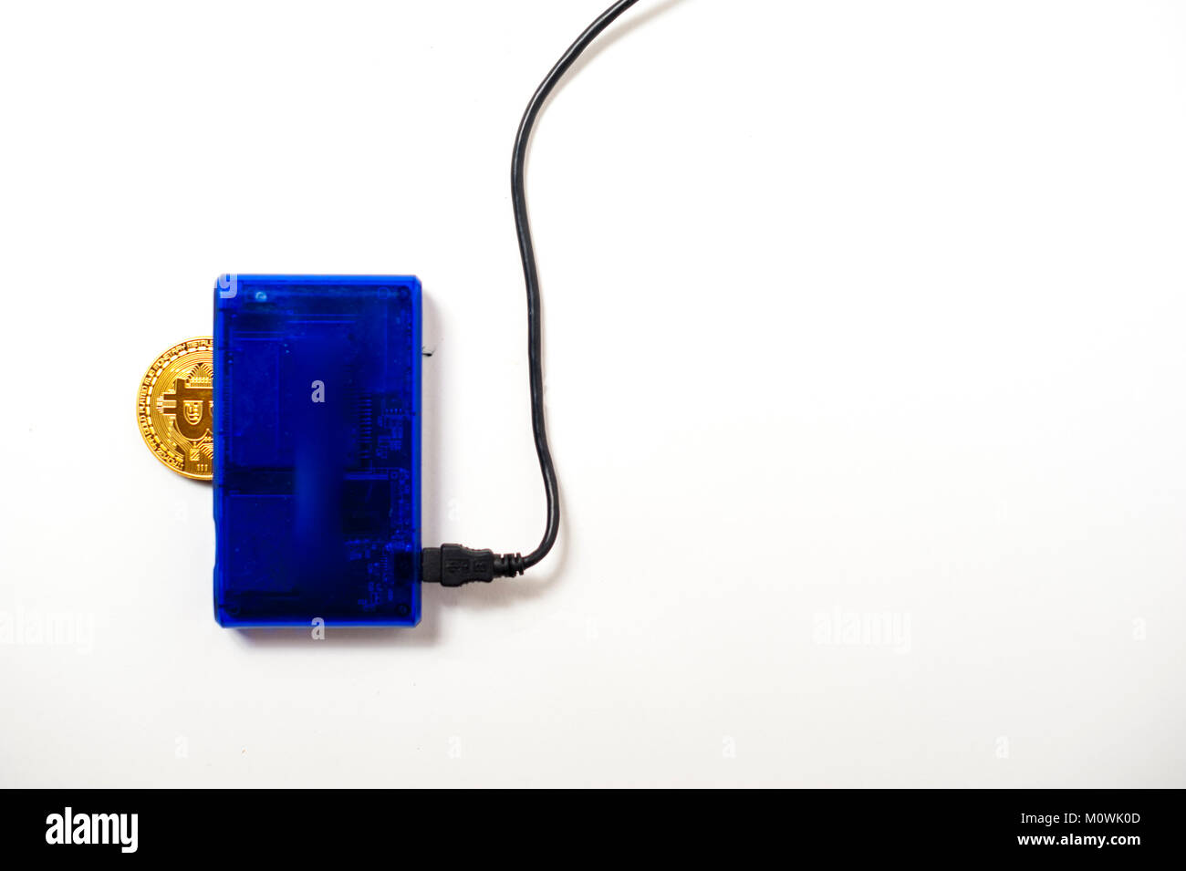 bitcoin electronic coin inside a digital card reader, white background ...