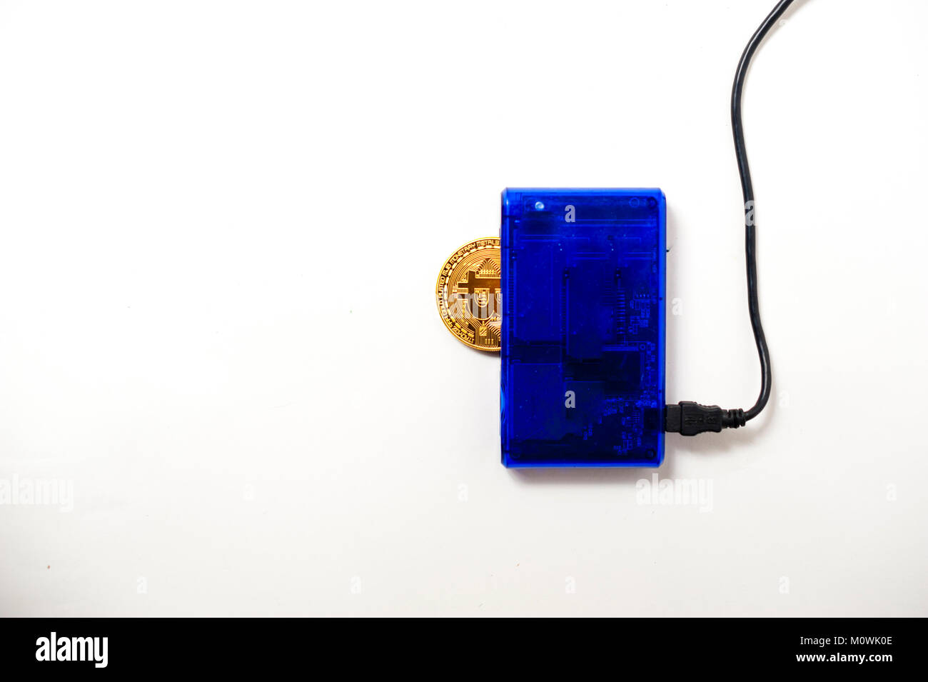 bitcoin electronic coin inside a digital card reader, white background ...