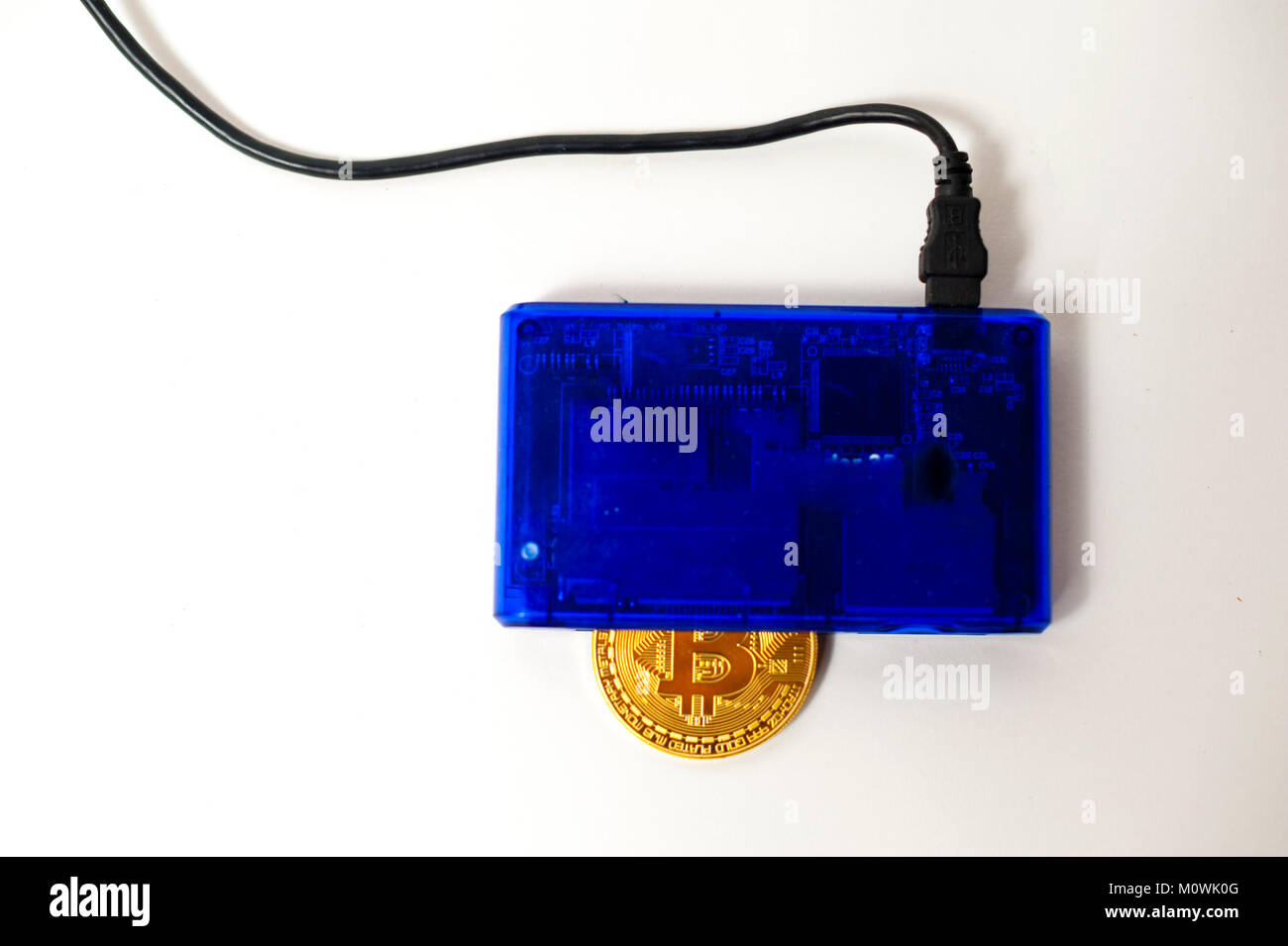 bitcoin electronic coin inside a digital card reader, white background ...