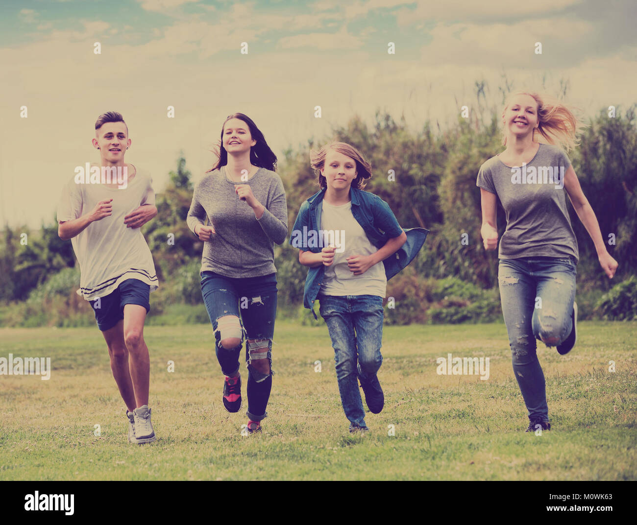 Two teenagers running boy girl hi-res stock photography and images - Alamy