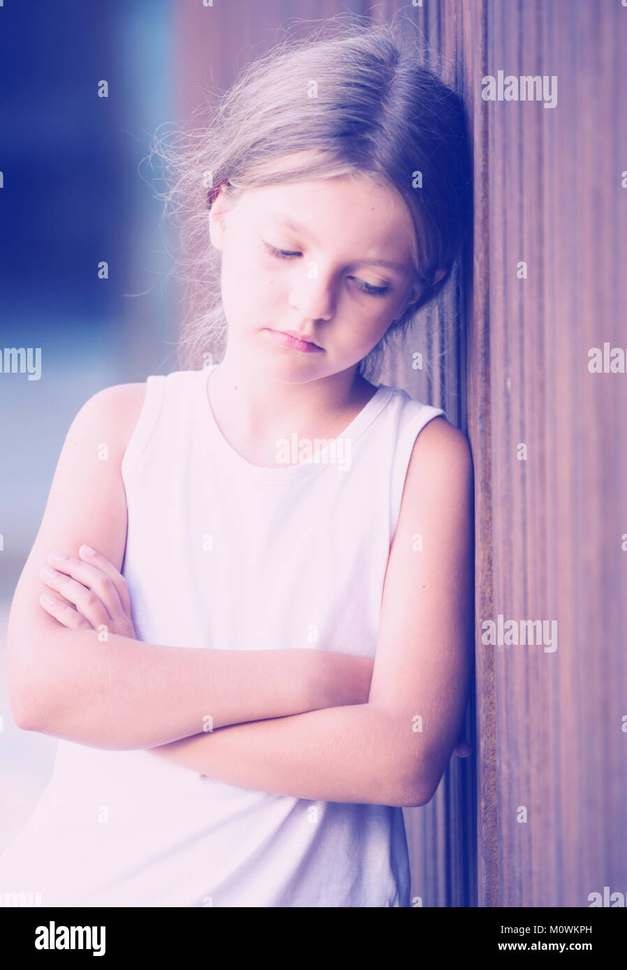 Depressed school girl sitting alone hi-res stock photography and images ...