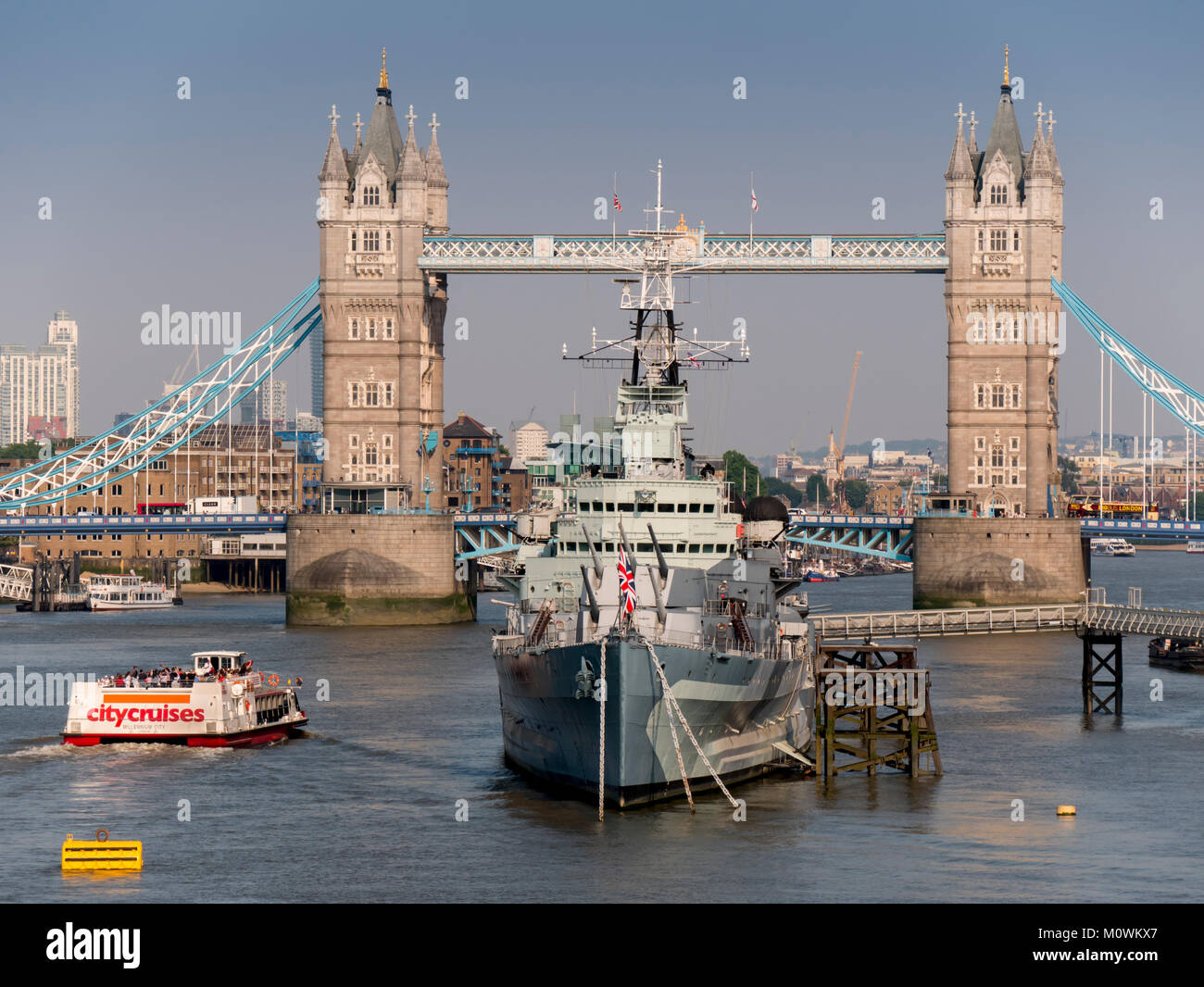 HMS Belfast, WW2 cruiser, is framed by Tower Bridge in london Stock ...
