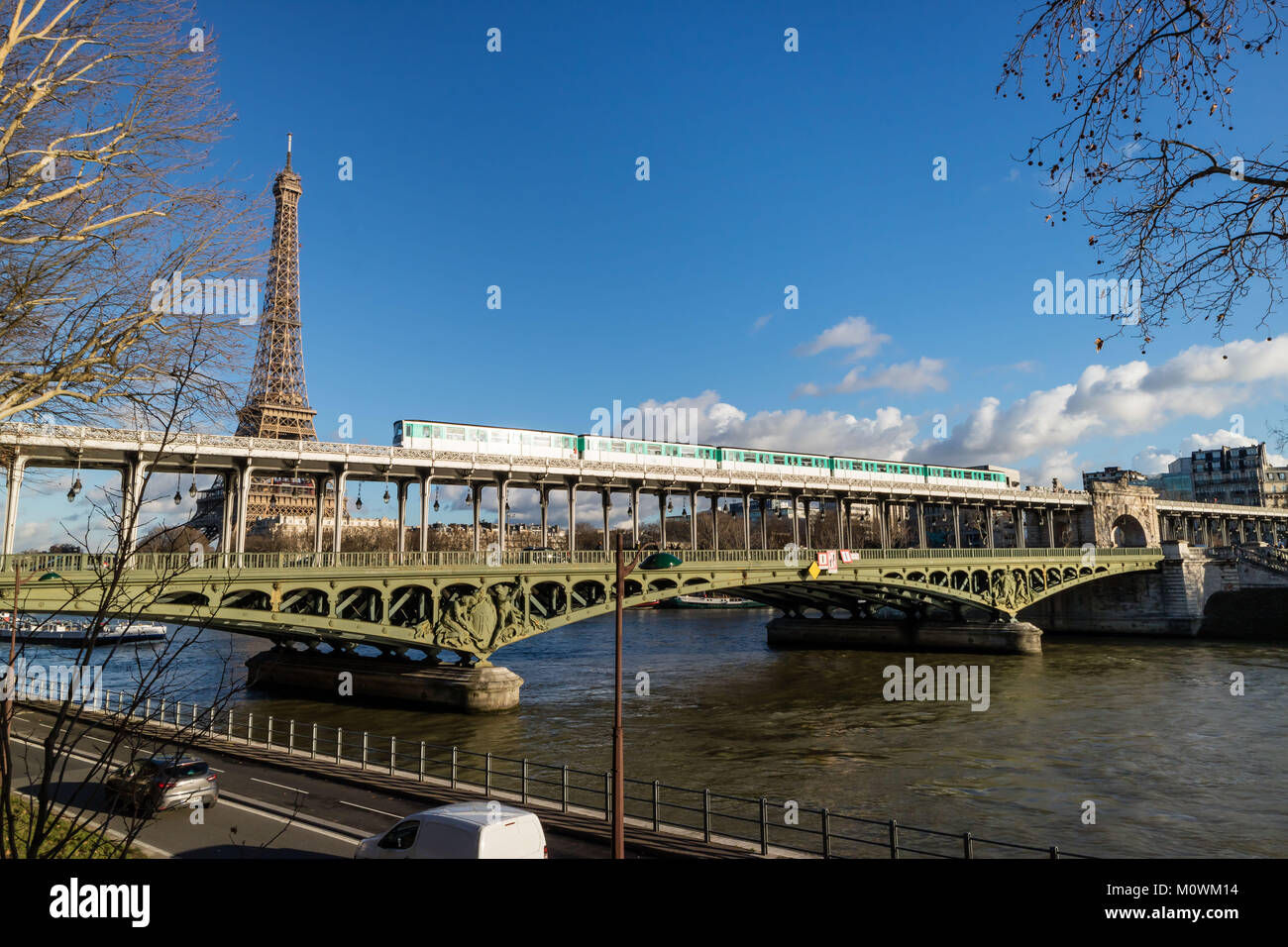 Eiffel Tower and Paris metro bridge with its blue sky Stock Photo - Alamy