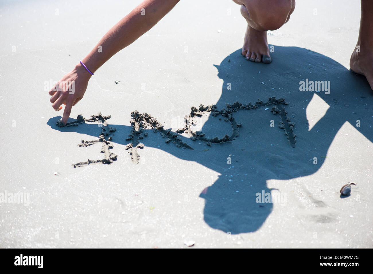 love message written in sand Stock Photo - Alamy