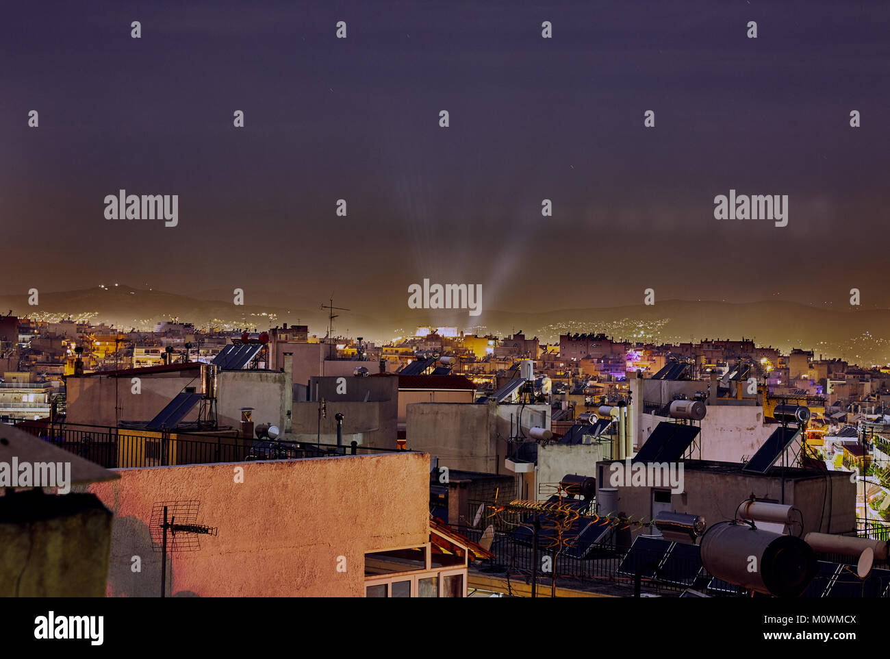 Energy in the night sky over the illuminated Acropolis of Athens Greece ...