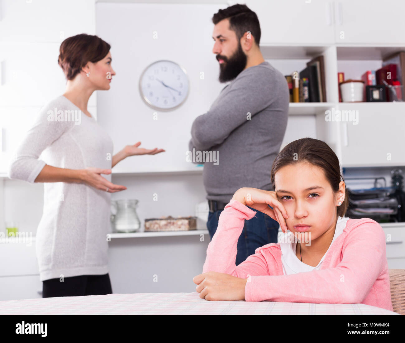 Father and mother having disagreement while their child at home Stock ...