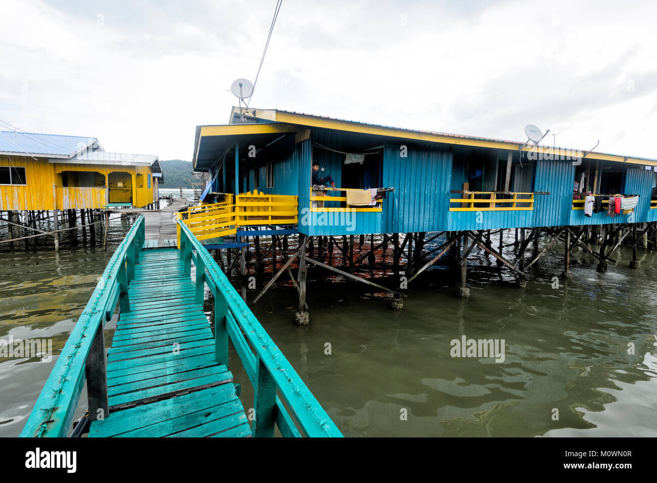Multi-coloured house on stilts in Sim Sim Water Village, the fishermen ...