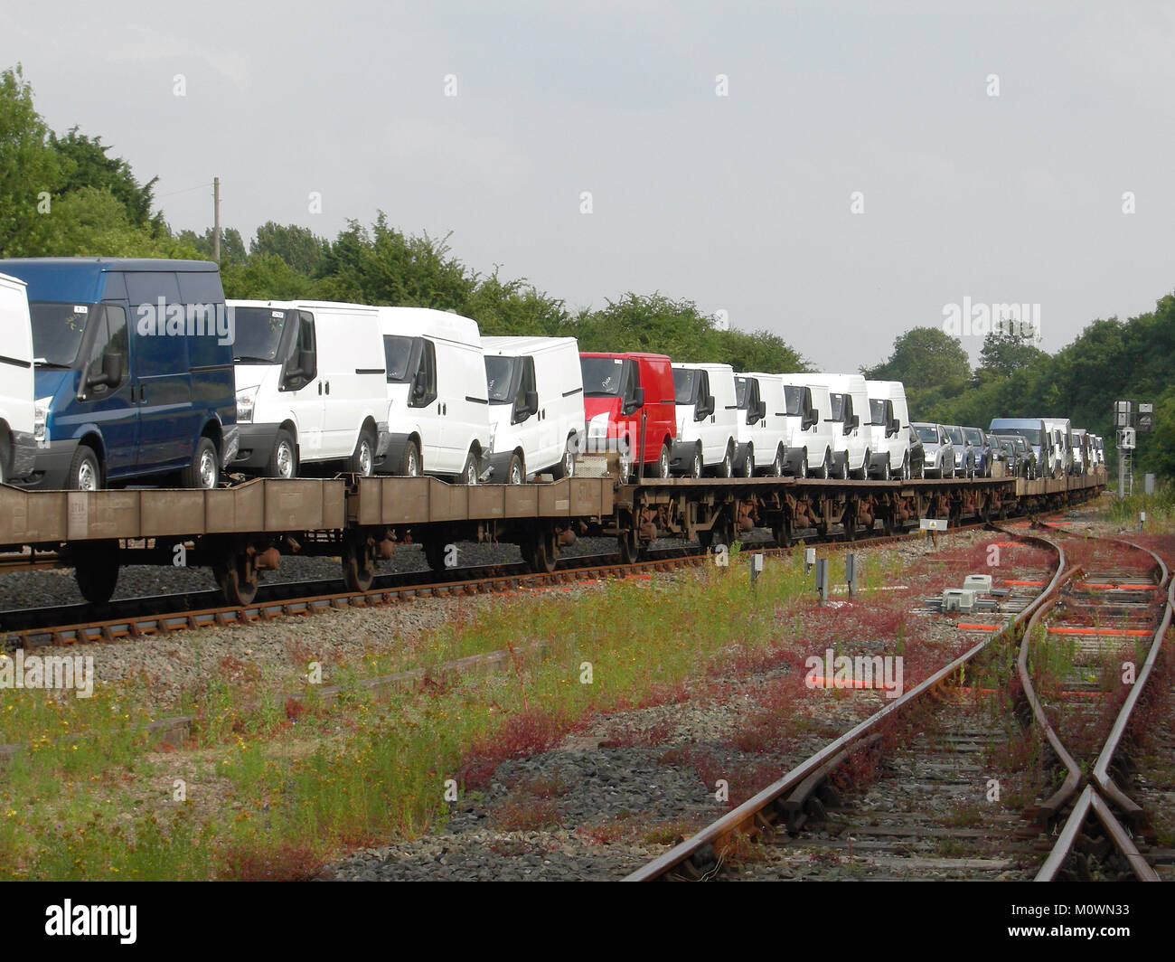 A freight train of road vehicles Stock Photo - Alamy