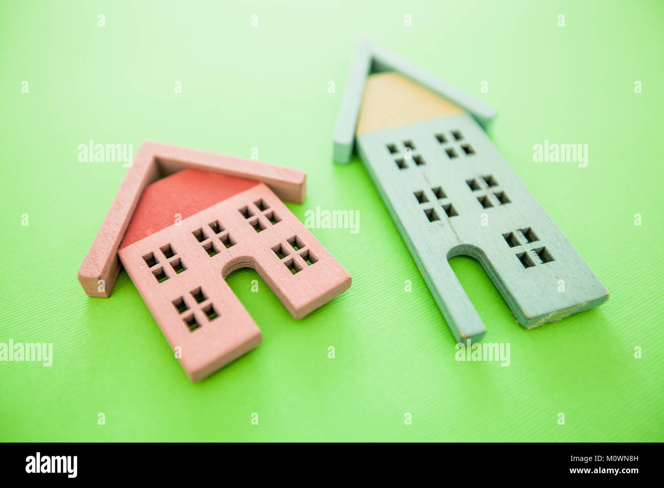 Real estate and property concept, models of houses, selling and buying ...