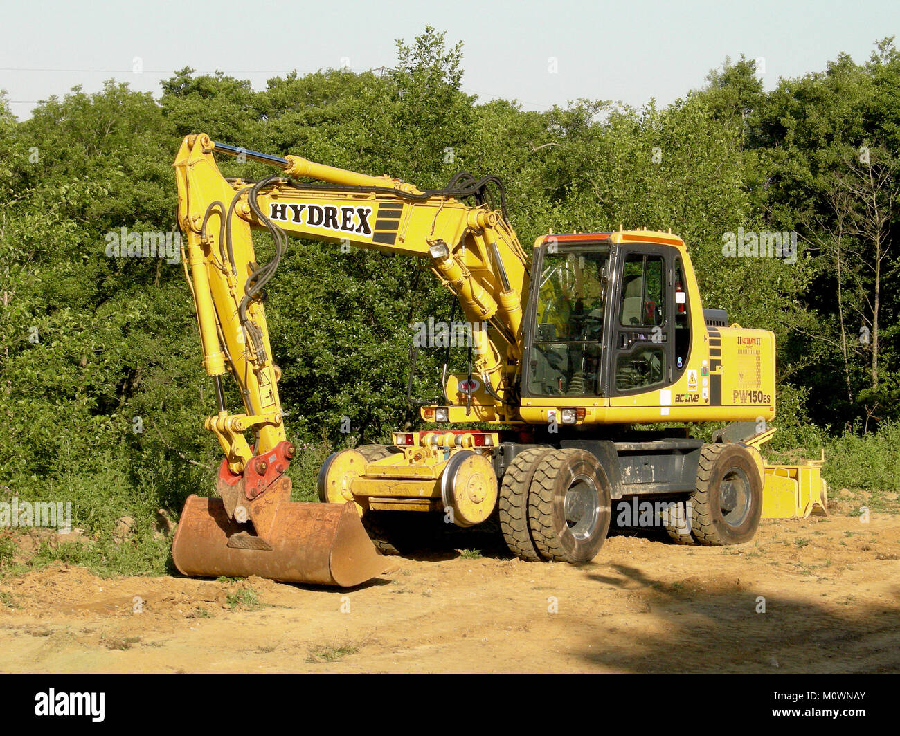 A yellow road-railer vehicle for track maintenance on the railway Stock ...