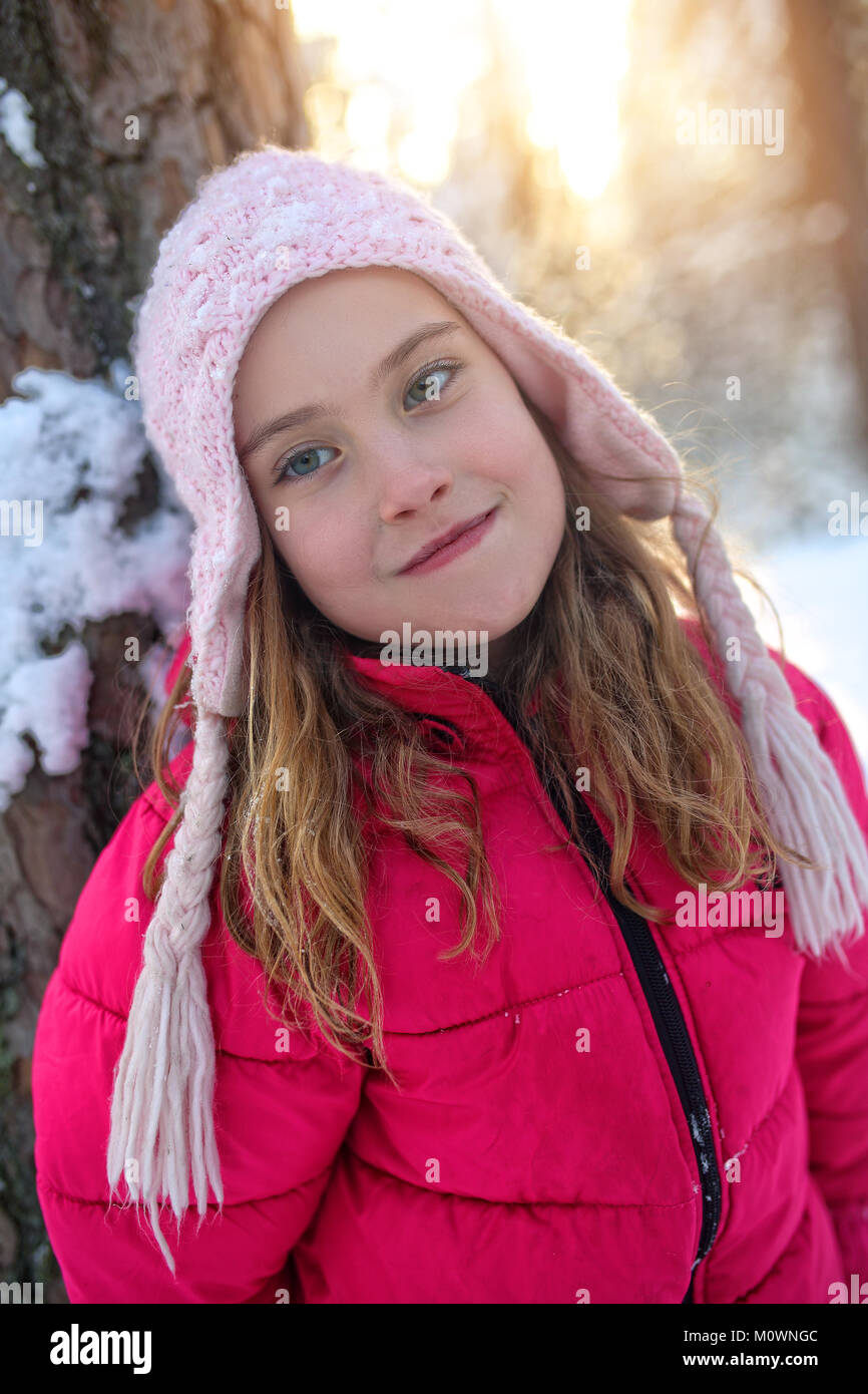 Lovely young girl in a cap in a winter day Stock Photo - Alamy