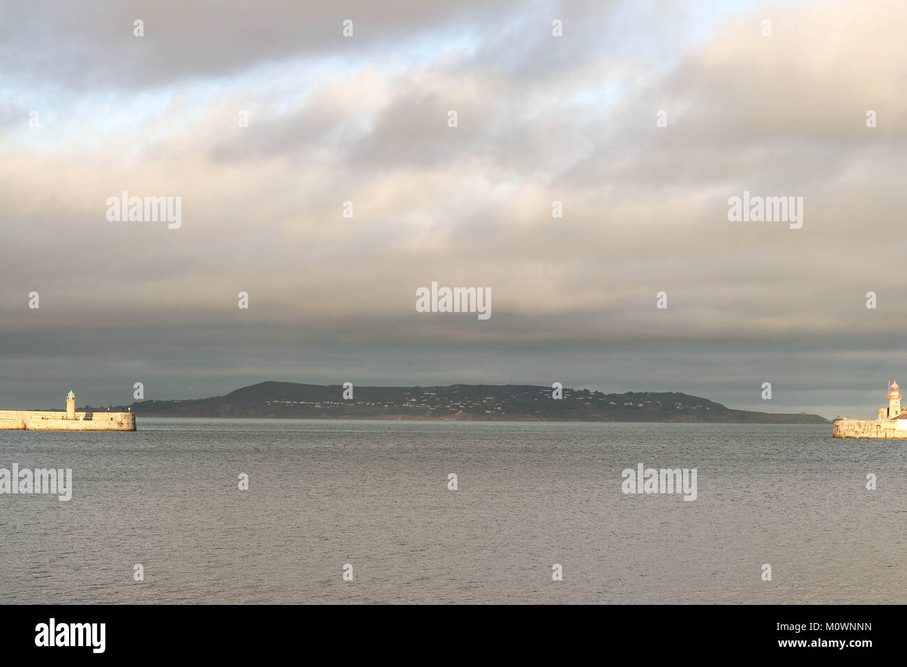 A view of Howth from Dun Laoghaire Pier in calm weather Stock Photo - Alamy