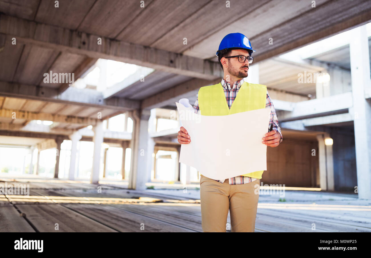 Engineers working on a building site Stock Photo - Alamy