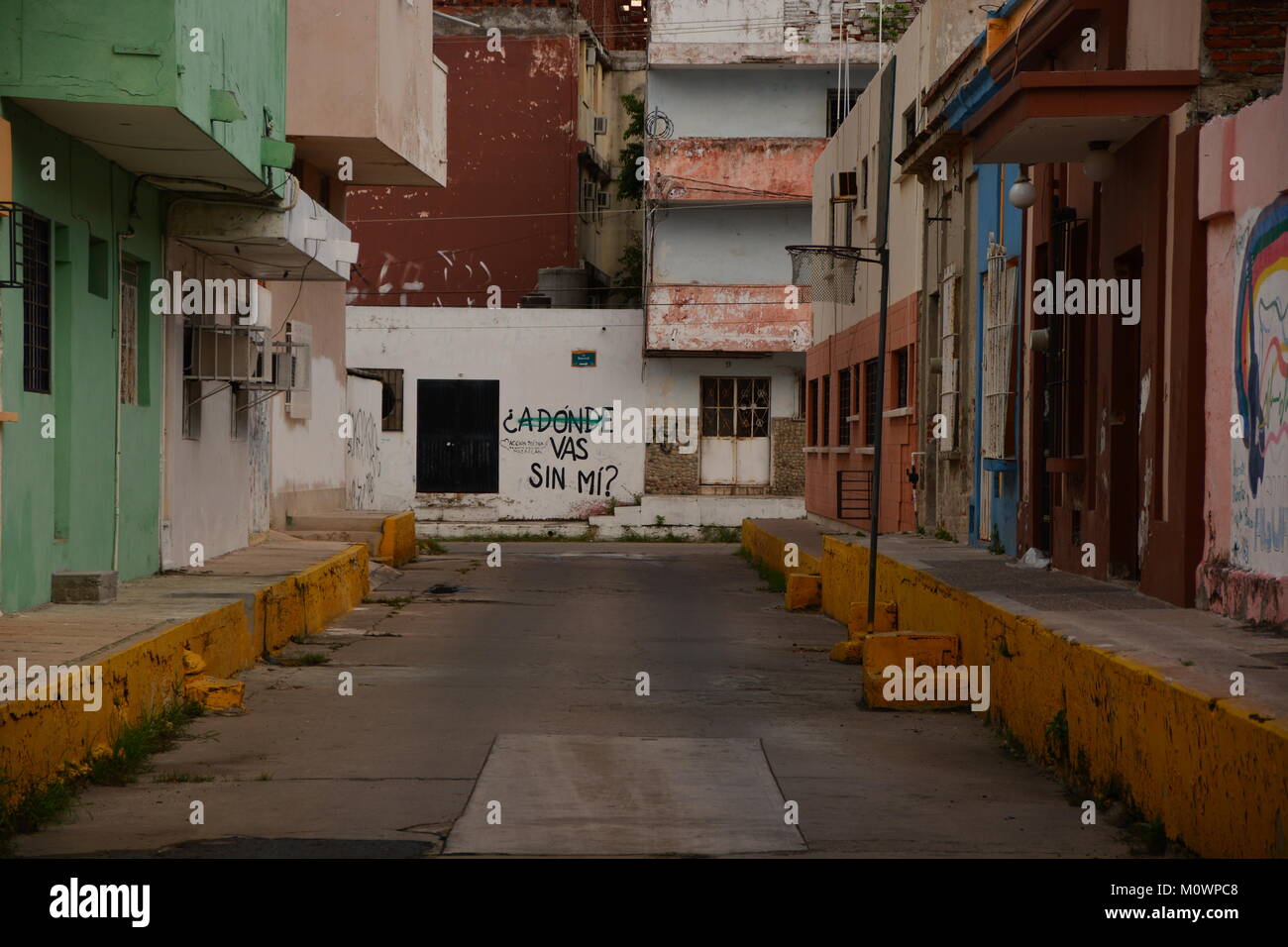 Streetart "Where do you go without me?" in run down street in Mazatlan ...