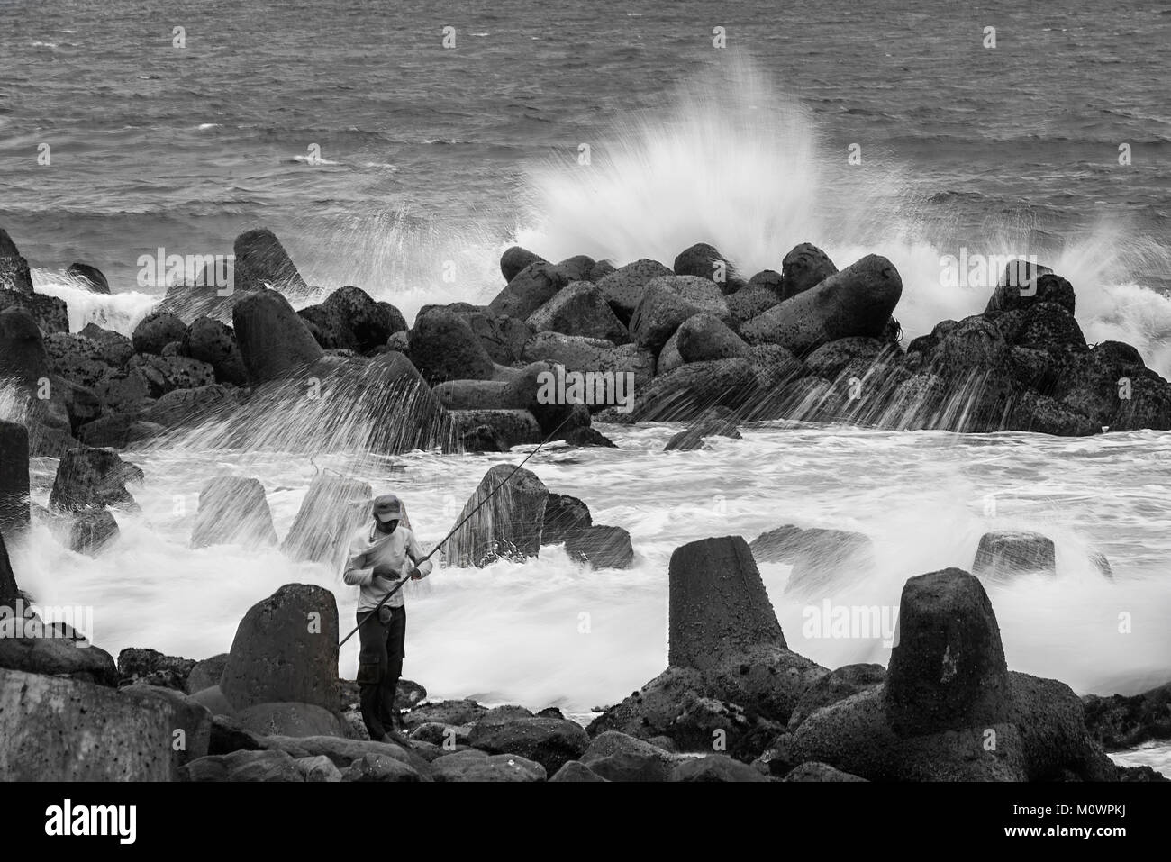 Local fisher man trying to catch fish, Indonesia Stock Photo - Alamy
