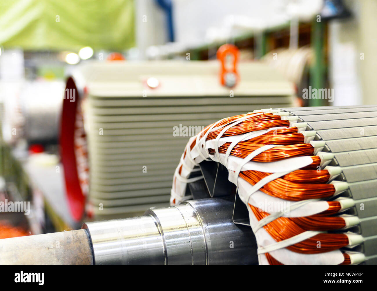mechanical engineering: closeup of electric motors in production in a ...