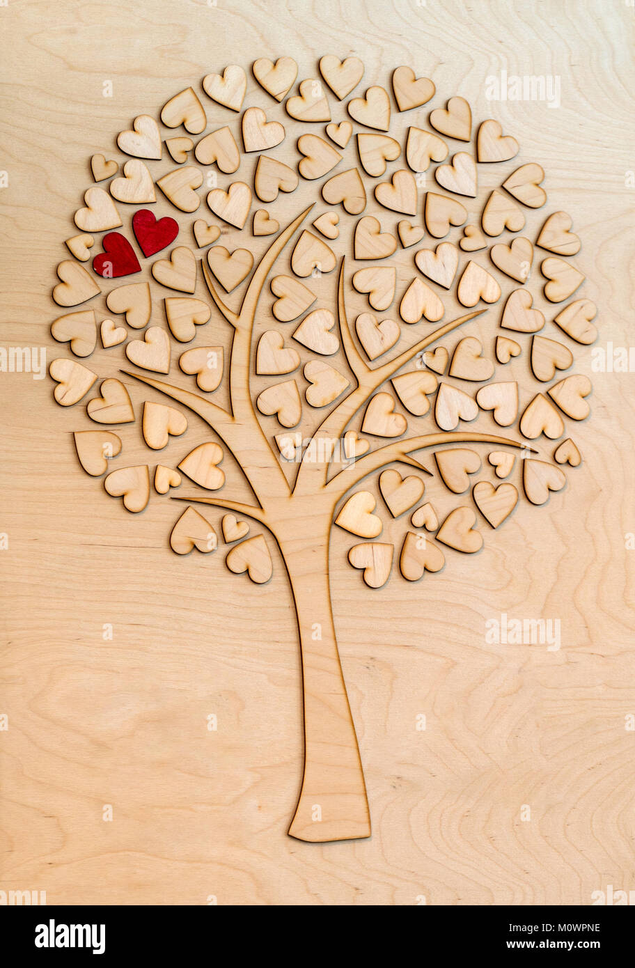 Ecological love tree with two red hearts Stock Photo - Alamy