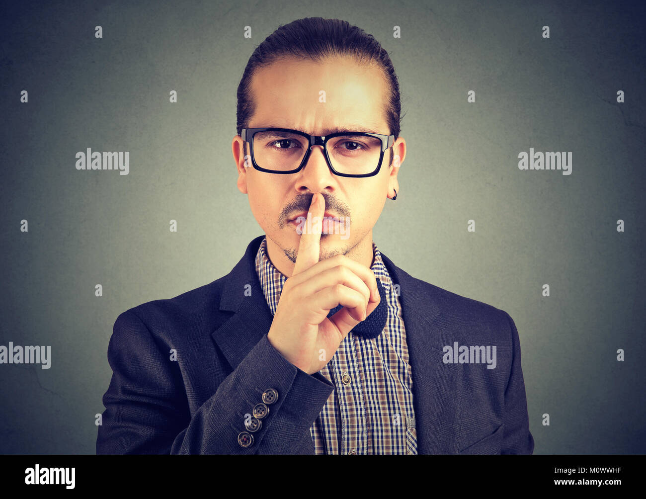 Finger over lips hi-res stock photography and images - Alamy