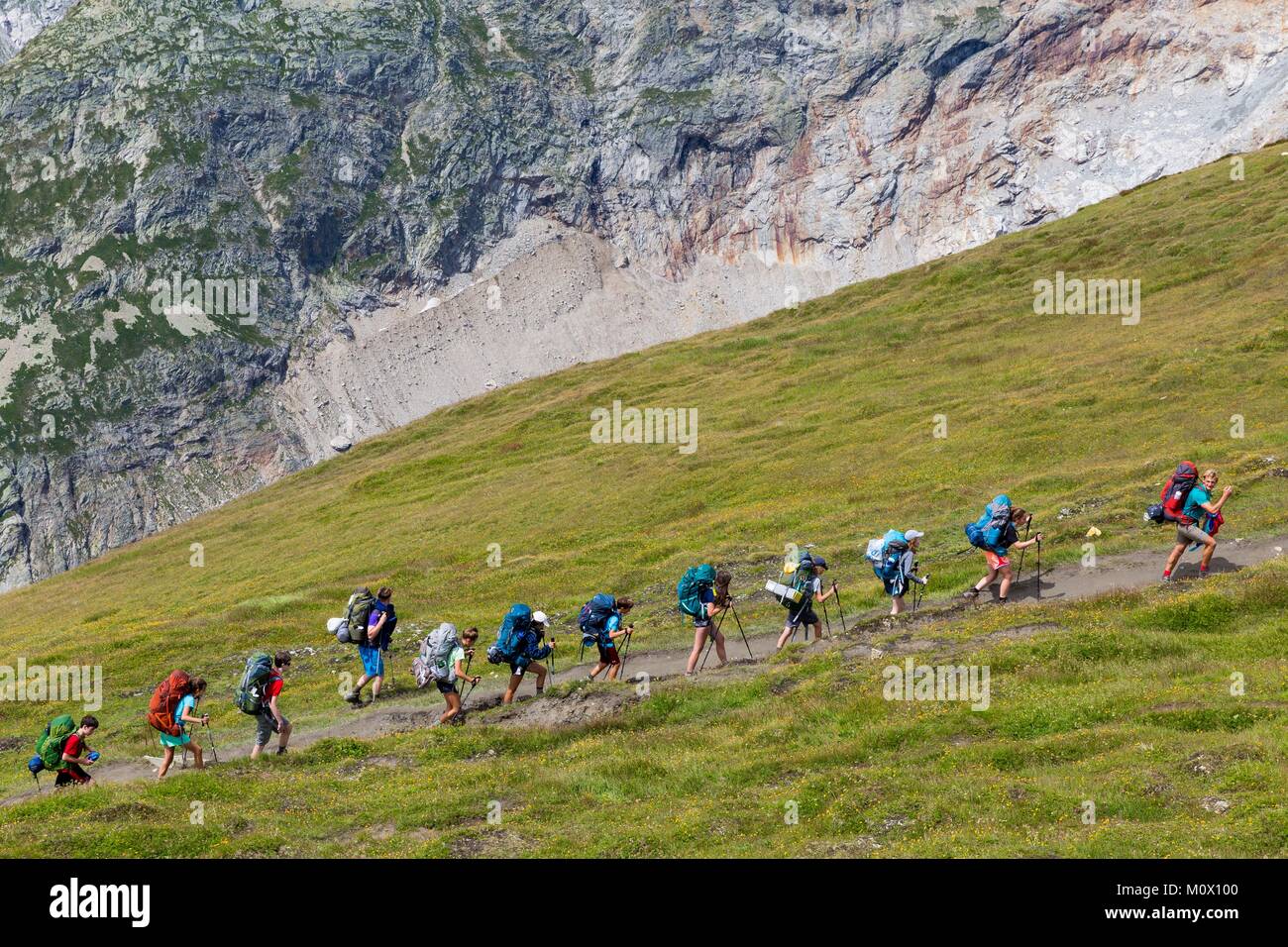 Italy,Valle d'Aosta,Courmayeur,Ferret valley,hikers at Grand Col Ferret ...