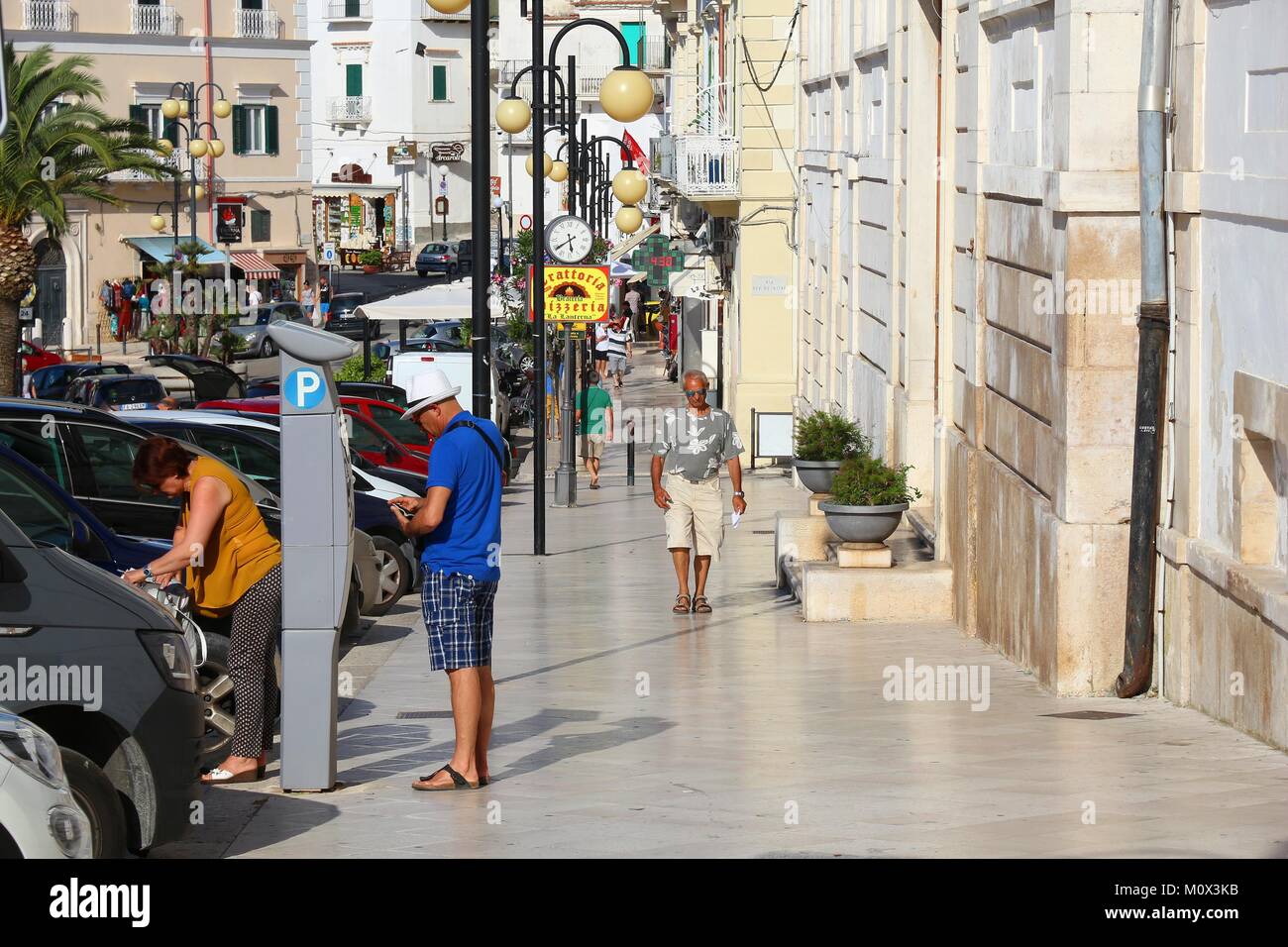 VIESTE, ITALY - JUNE 5, 2017: People visit Old Town streets in Vieste ...
