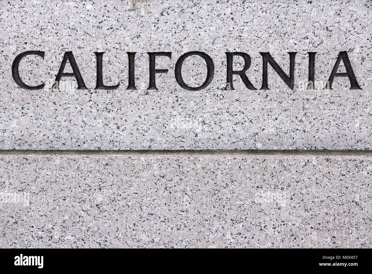 California - US state name carved in grey granite stone Stock Photo - Alamy