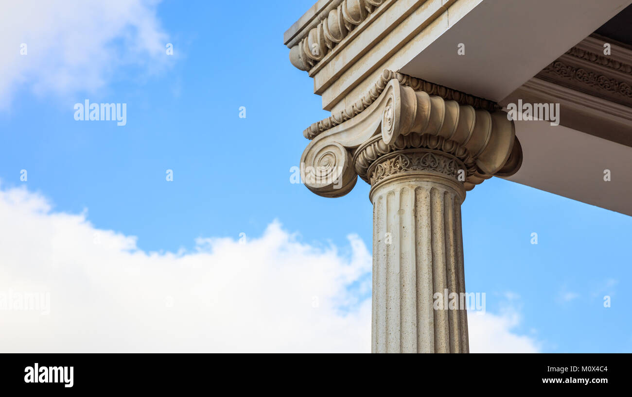 Marble pillar detail of a building facade. Ancient ionic column of ...