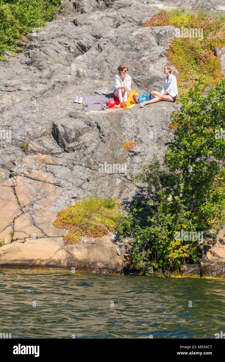 Sweden,Stockholm,tanning on the rocks Stock Photo - Alamy