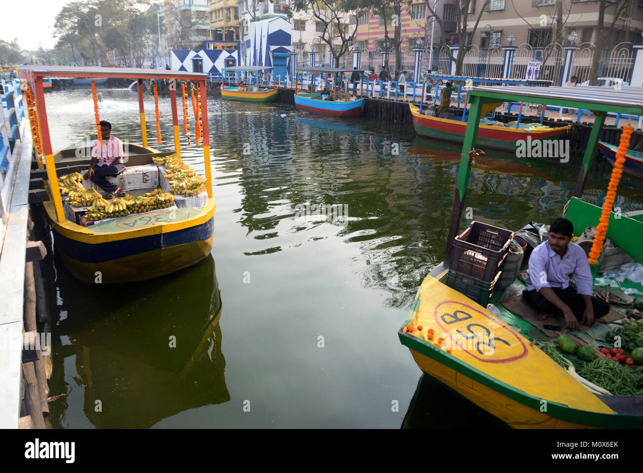 Kolkata, India. 24th Jan, 2018. Vegetable and fruit seller wait for ...