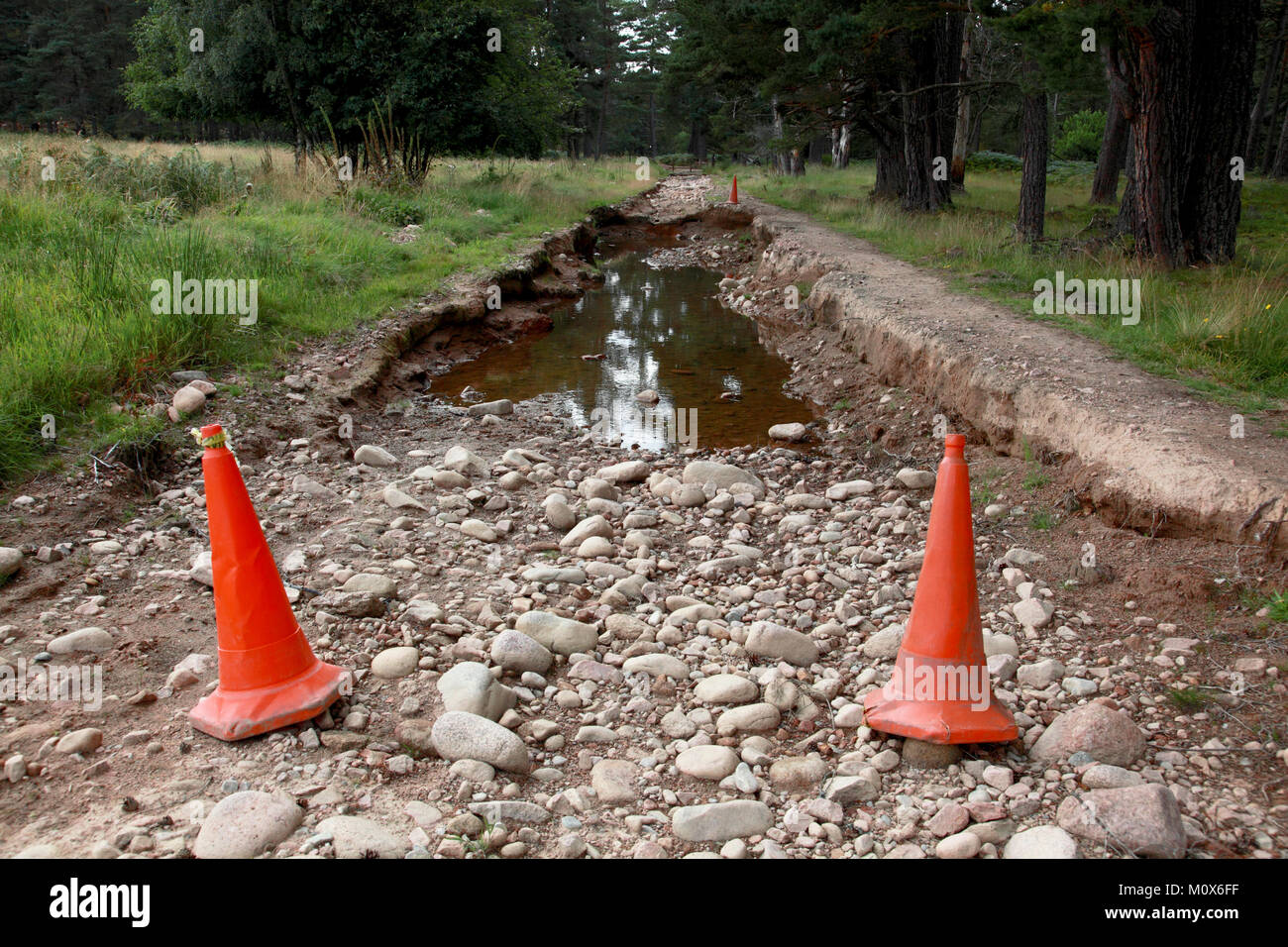A wide path washed away by the flooding caused by Storm Frank in north ...