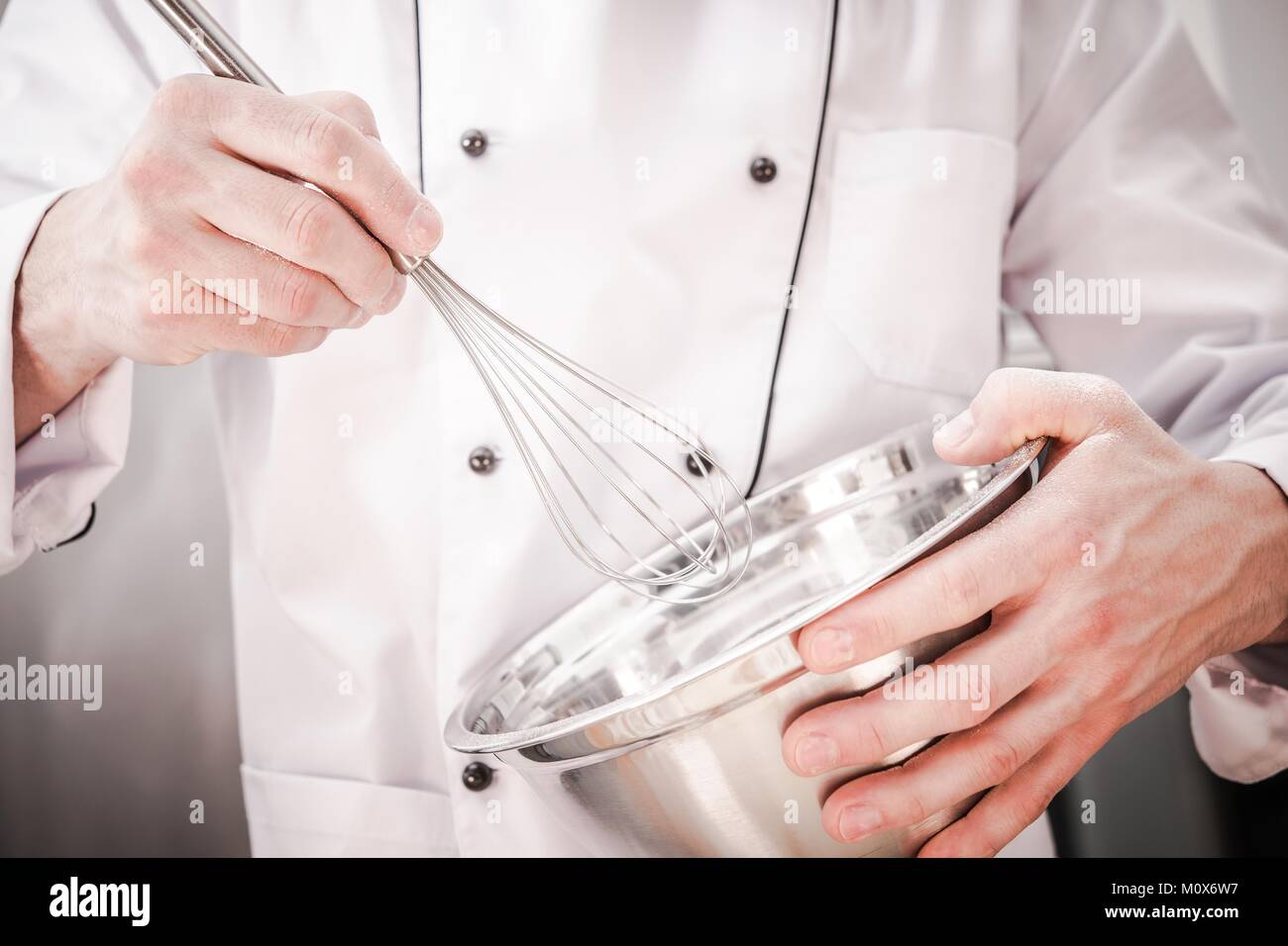 Caucasian Italian Chef Mixing Ingredients in the Stainless Steel Bowl ...
