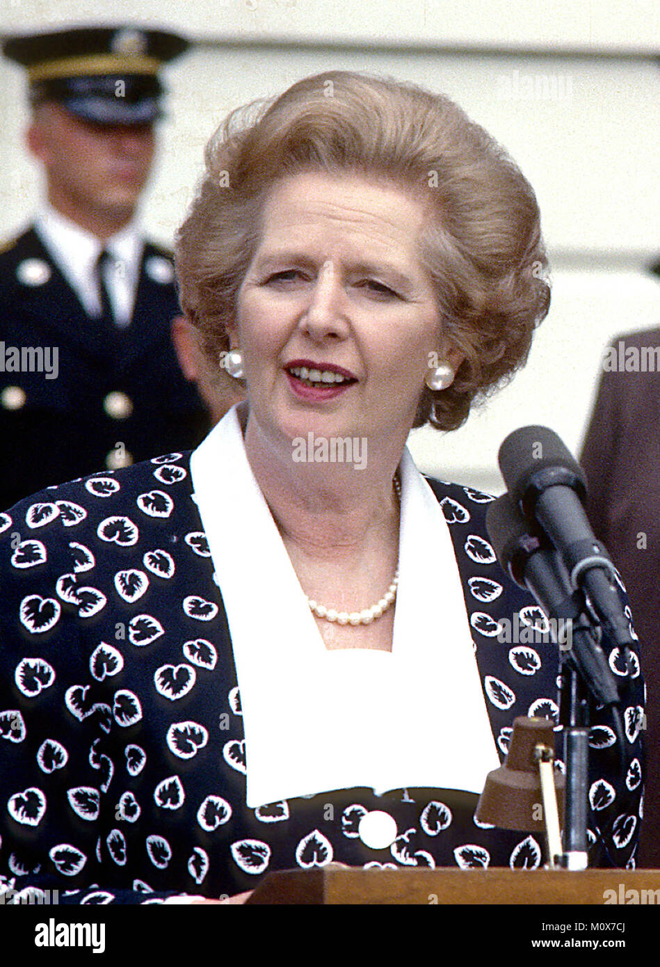 Prime Minister Margaret Thatcher of the United Kingdom, left, makes ...