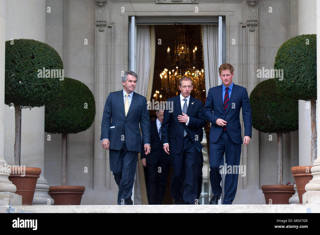 Prince Harry (R) and Sir Peter Westmacott (L), the British Ambassador ...