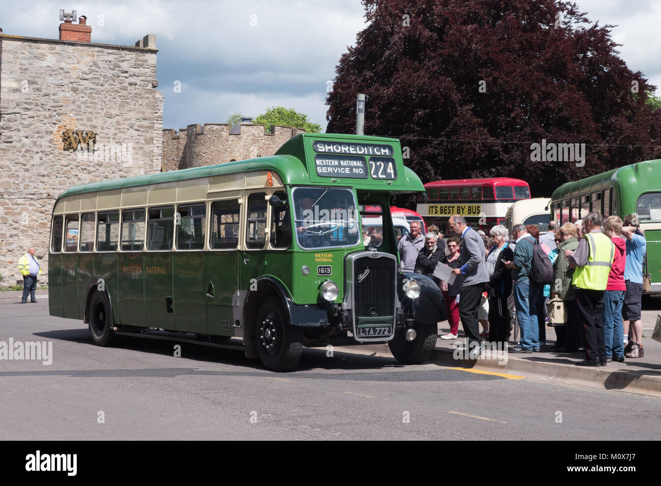 people queuing for a ride on a vintage bus Stock Photo - Alamy