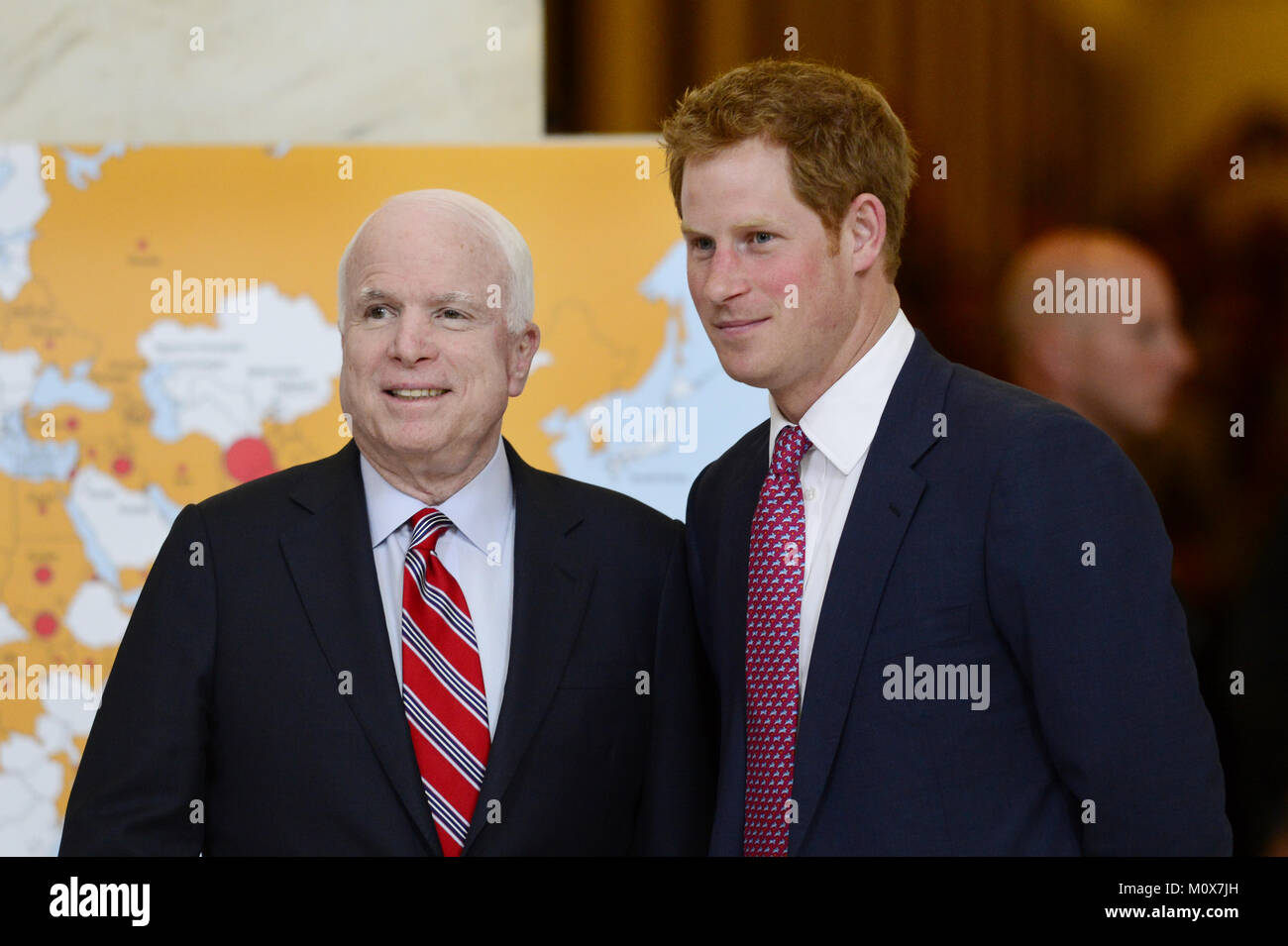 Prince Harry (R) of Wales tours a HALO Trust photo exhibit on landmines ...
