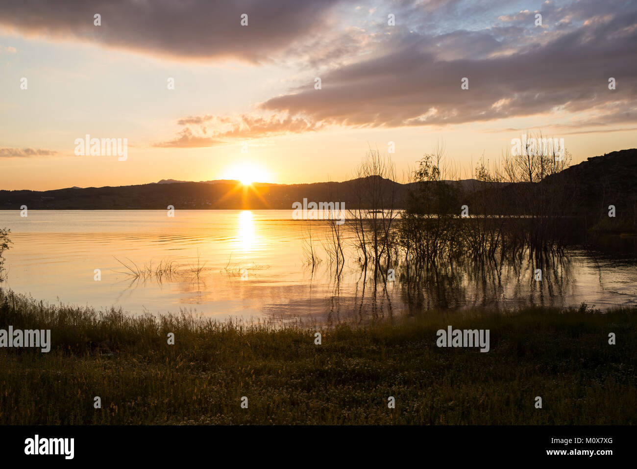 Nice landscape with sunset on lake Stock Photo - Alamy