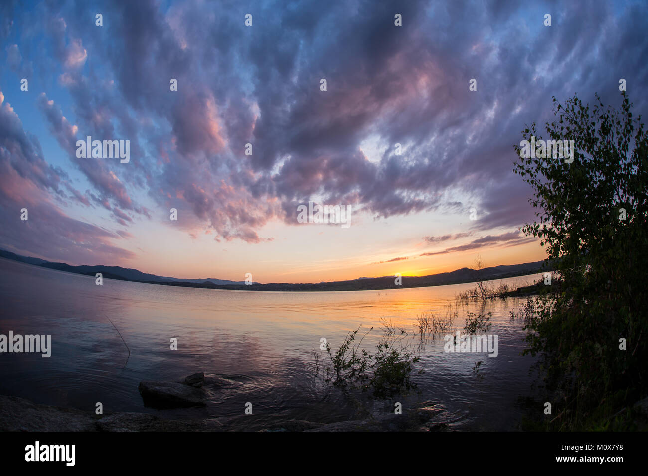 Nice landscape with sunset on lake Stock Photo - Alamy