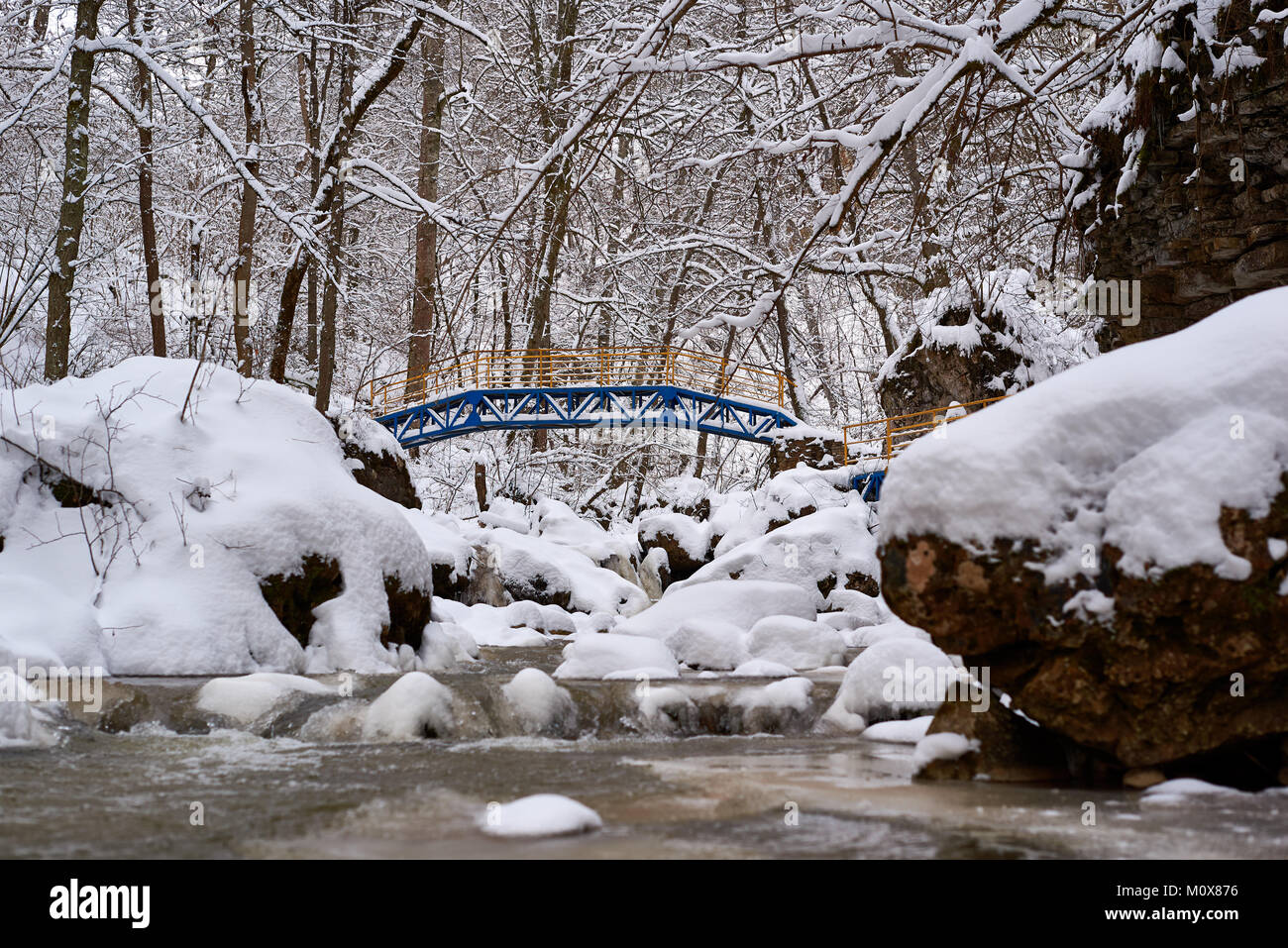 Mountain stream in winter, snow-covered beaches and forest Stock Photo ...