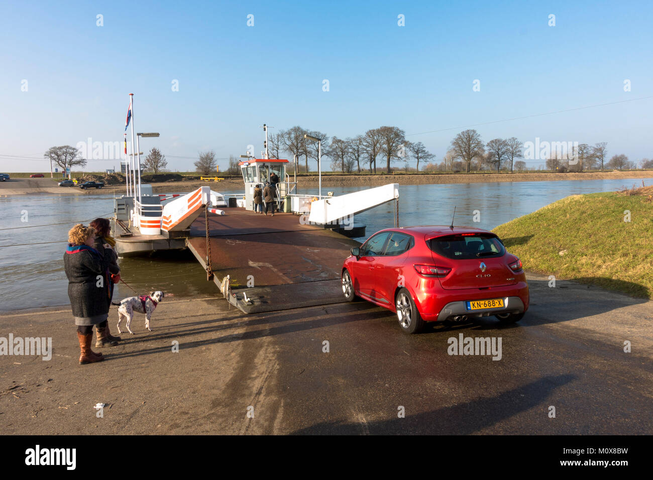Car driving on Ferry, ferry bridge, ferryboat crossing river Maas, the ...