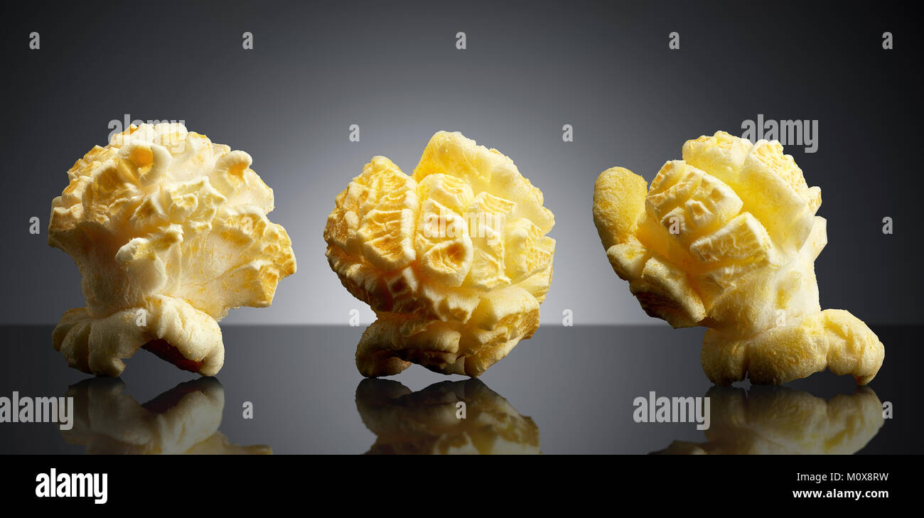 Group of popped popcorn on a black background Stock Photo - Alamy