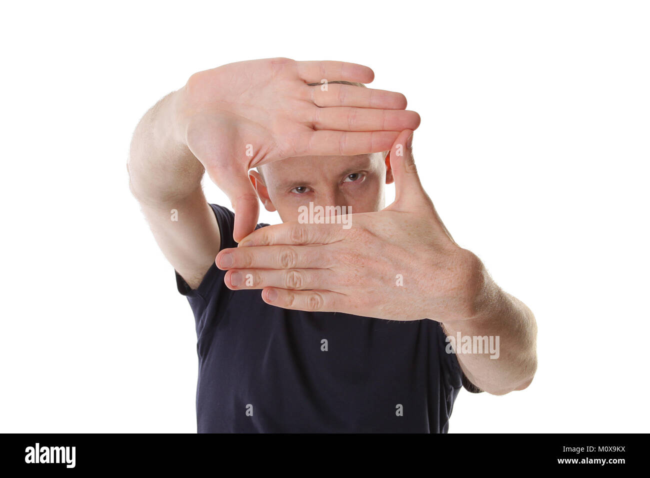 man designer creates a frame with her hands. Focus on hand Stock Photo ...
