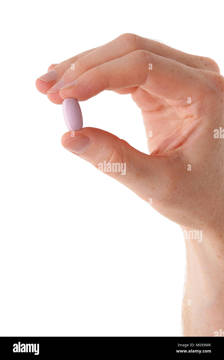 Male hand with pill over white background Stock Photo - Alamy