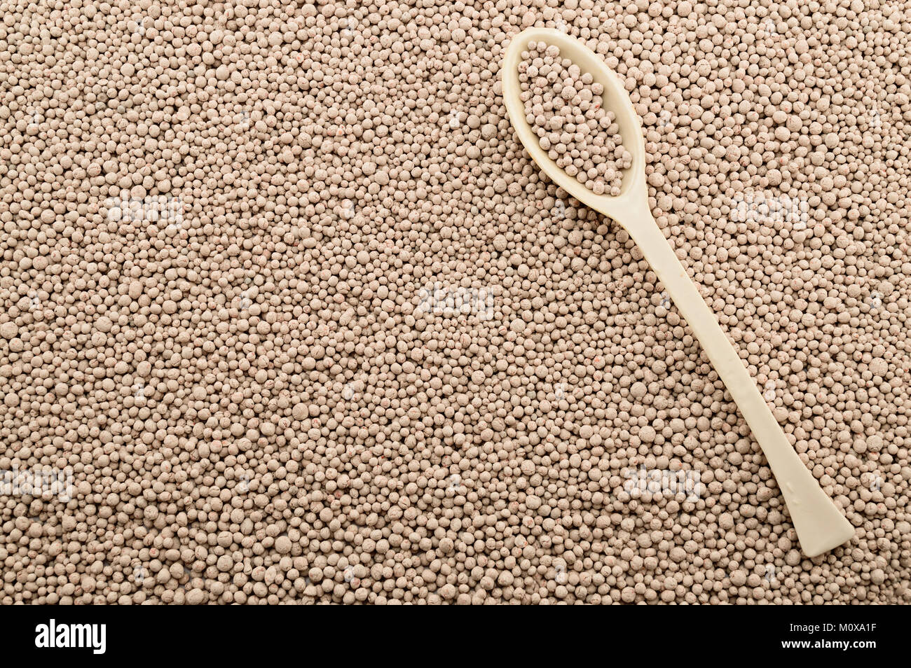 Porcelain laboratory spoon on composite mineral fertilizers Stock Photo ...