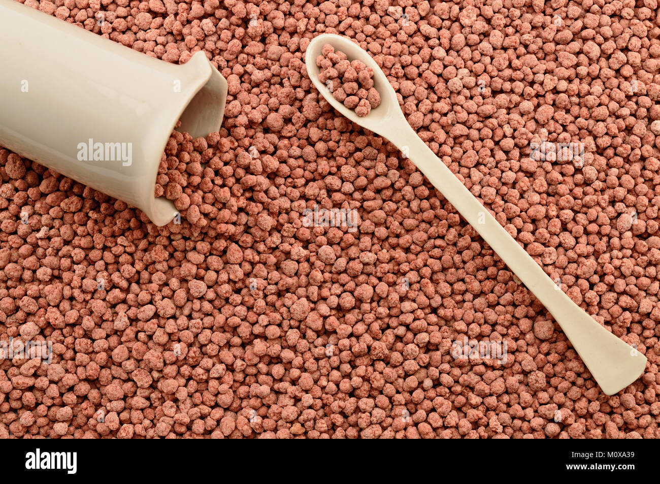 Porcelain laboratory spoon and beaker on composite mineral fertilizers ...