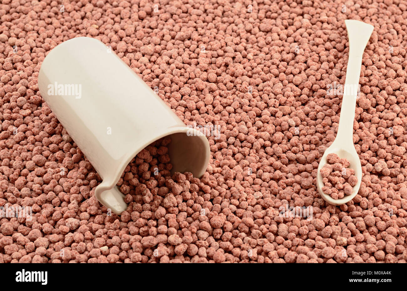 Porcelain laboratory spoon and beaker on composite mineral fertilizers ...
