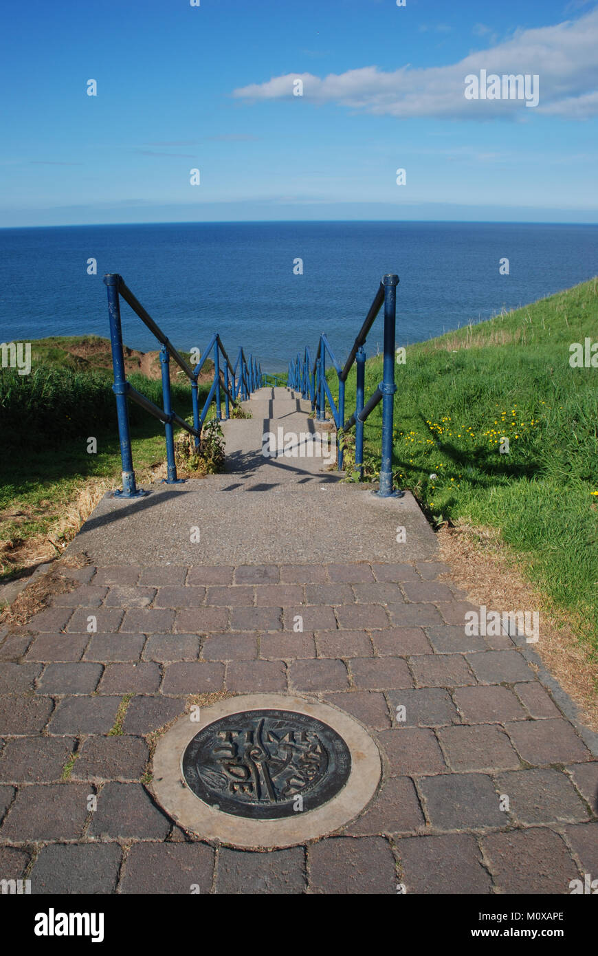 Time and Tide plaque atop steps to Seaham beach in the North East of ...