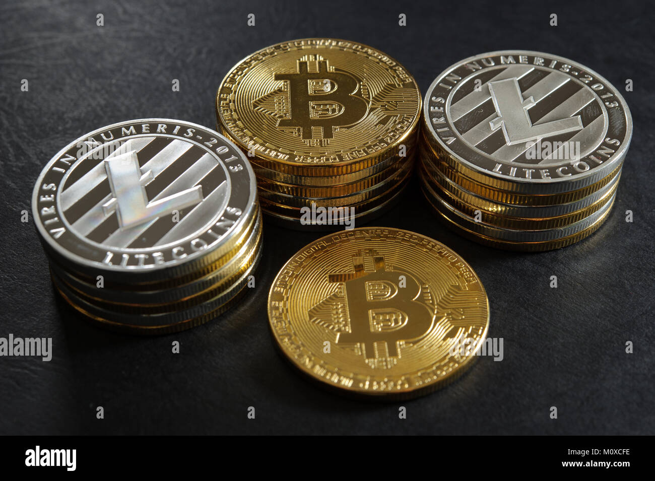 Three stack of cryptocurrency coins with single bitcoin Stock Photo - Alamy