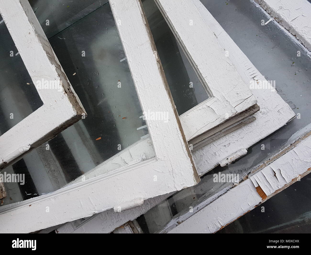 White straight corners of wooden vintage windows with peeling paint and ...